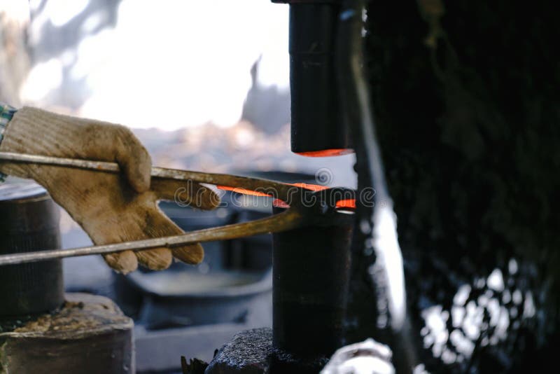 The Blacksmith is Forging Very Hot Iron To Make Various Tools Stock ...