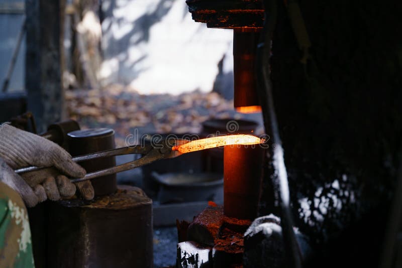The Blacksmith is Forging Very Hot Iron To Make Various Tools Stock ...