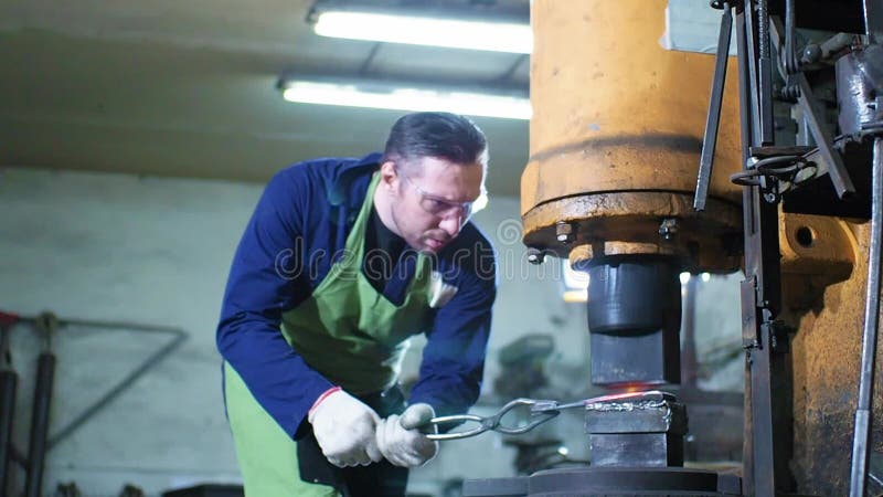 Blacksmith Hammering Hot Iron Automatic Hammer Stock Video - Video of ...