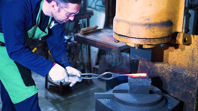 Blacksmith Hammering Hot Iron Automatic Hammer Stock Video - Video of ...