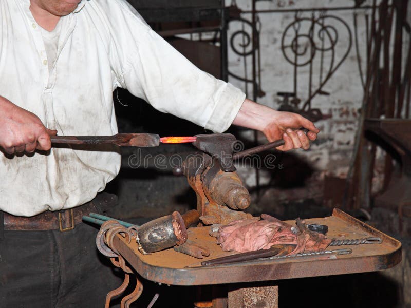 Blacksmith Hammering metal stock image. Image of bench - 9261539