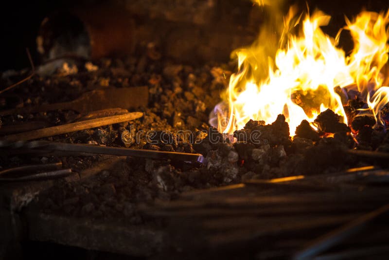 Blacksmith Heating a Metal Rod Stock Image - Image of industry, anvil ...