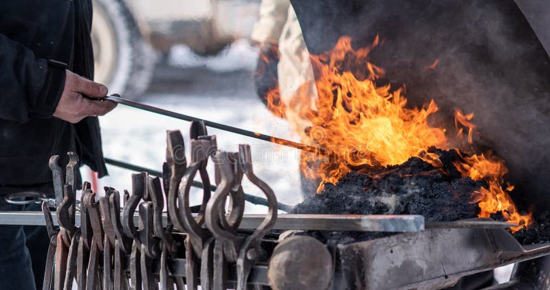 Blacksmith Heating Some Metal on Fire Stock Photo - Image of industrial ...