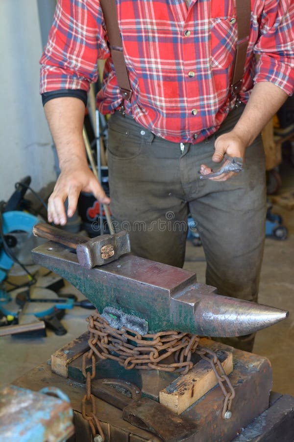 Blacksmith in His Home Workshop Making Tools Stock Photo - Image of ...