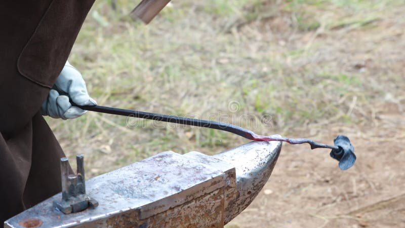 Blacksmith Hitting Hot Metal Bar with Massive Hammer on Anvil in Slow ...