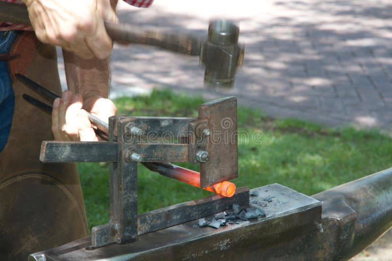 Blacksmith and Hot Iron Rod Stock Image - Image of moving, quickly ...