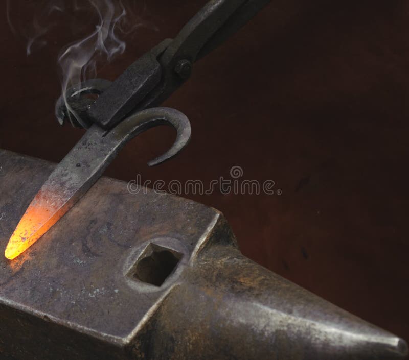 Blacksmith with hot iron stock photo. Image of apron - 73373428