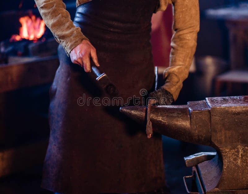 Blacksmith Makes a Product from Iron in the Forge Stock Image - Image ...