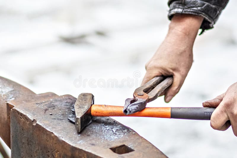 A Blacksmith Man Forge a Horseshoe on an Anvil Stock Photo - Image of ...