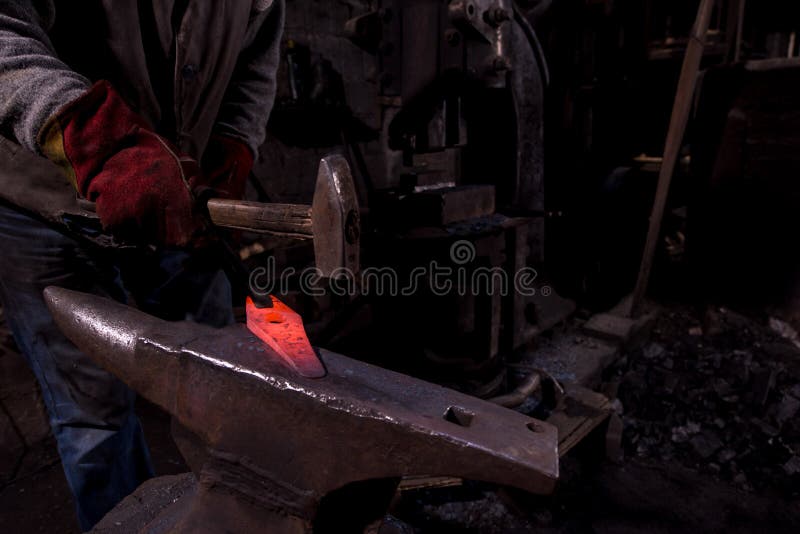 Blacksmith Manually Forging the Molten Metal Stock Photo - Image of ...