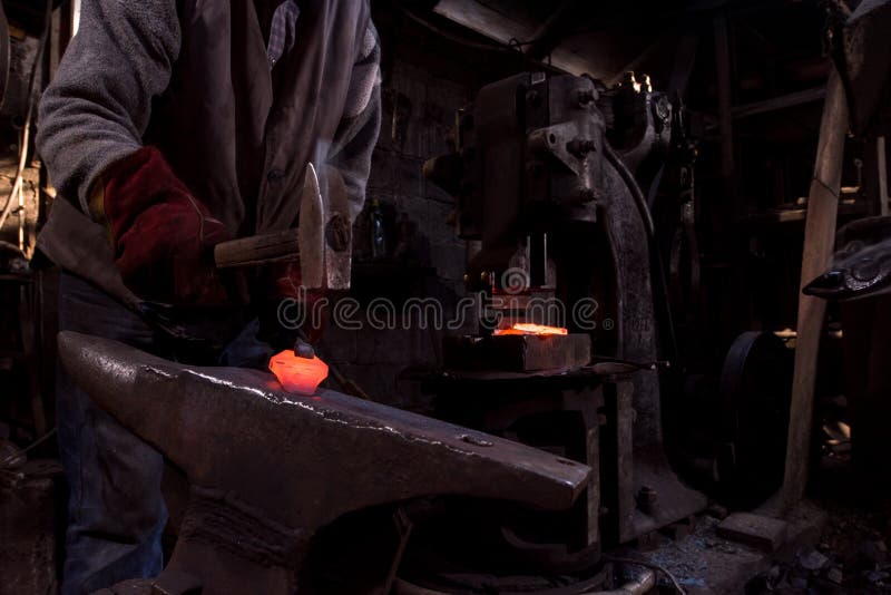 Blacksmith Manually Forging the Molten Metal Stock Photo - Image of ...