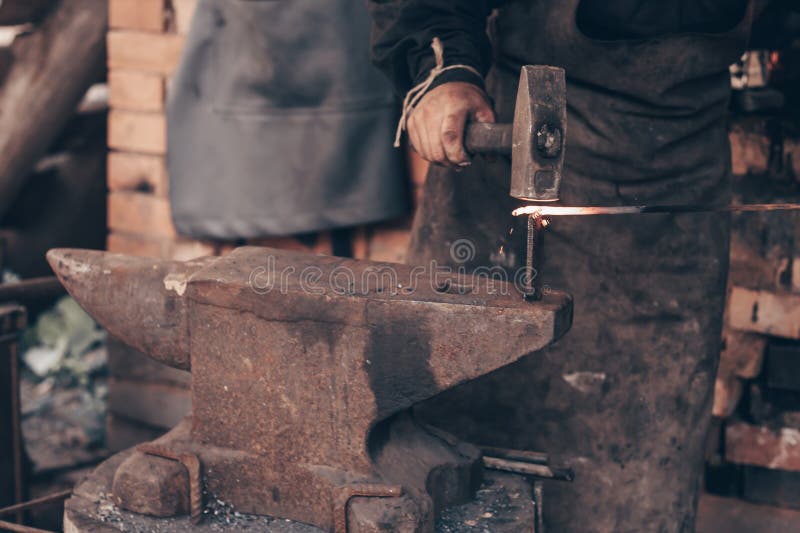 Blacksmith Process Glowing Metal with Hammer on Anvil in Forge. Dirty Hands of Farrier Strike ...