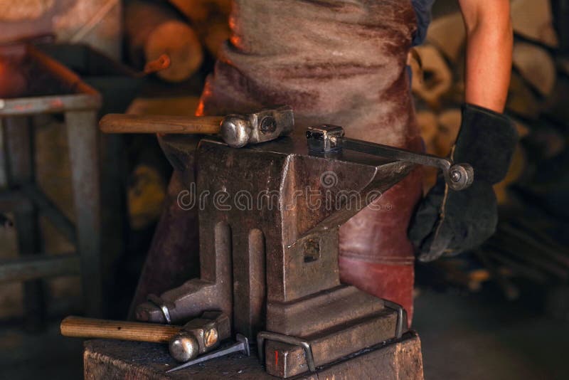 Blacksmith is Processing a Hot Metal Object of a Spiral Shape at Anvil ...
