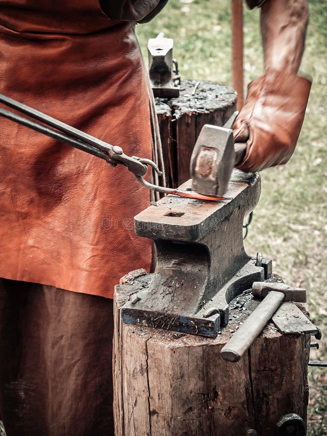 Blacksmith Bending Red Hot Iron Stock Image - Image of tong, artist: 952341