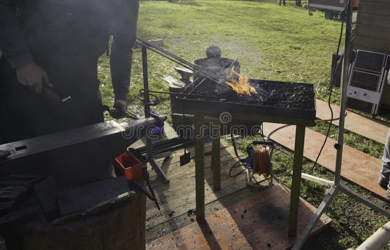 Blacksmith with Red-hot Iron and Open Charcoal Fire Stock Photo - Image ...