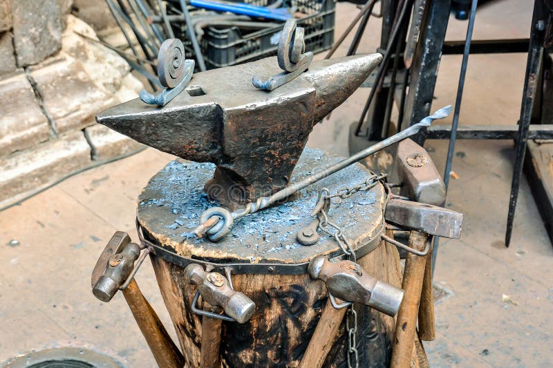 A Blacksmith& X27;s Forge with a Hammer and an Anvil on Top Stock Photo ...