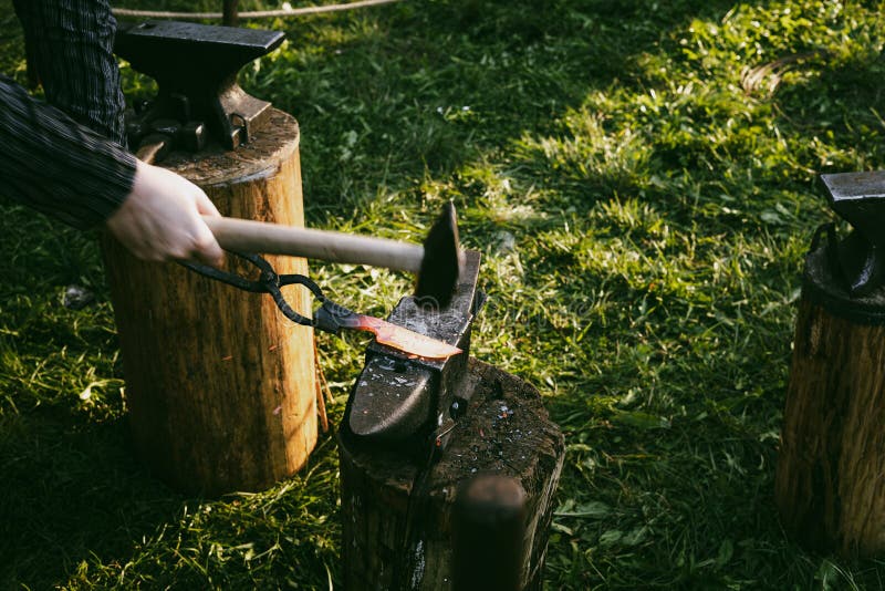 Blacksmith S Workshop in the Open Air. the Process of Forging a Knife ...