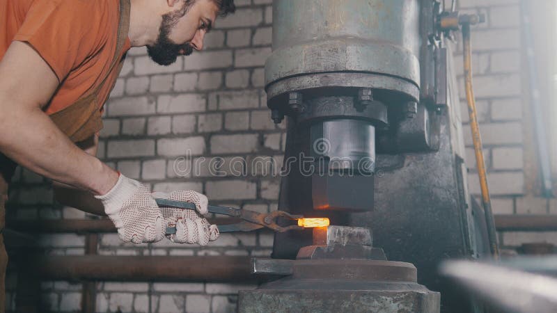 The Blacksmith Treats the Metal Part Under the Hard Pressure Stock ...