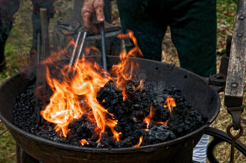 Blacksmith at work stock photo. Image of tongs, forge - 11209896