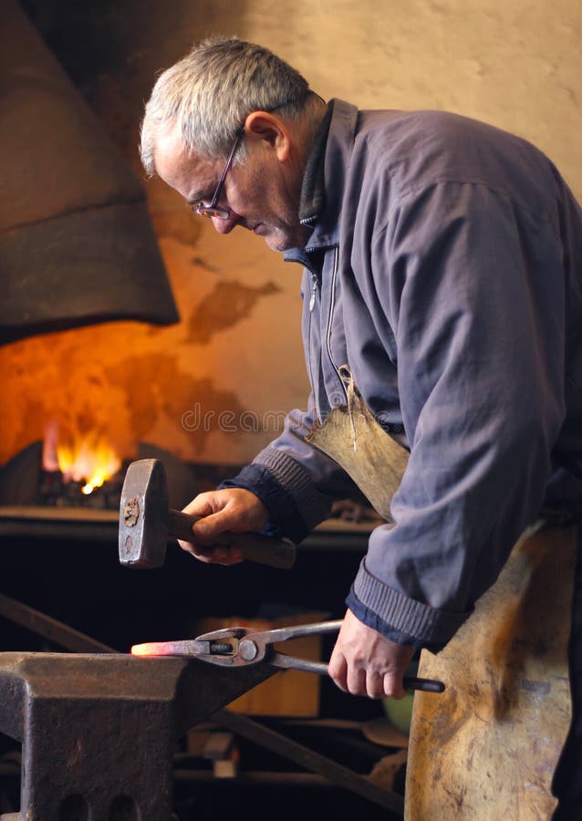 Blacksmith at work stock image. Image of handwork, anvil - 18594003