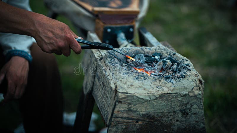 Blacksmith at Work – Close-up of Hands Forging a Nail Stock Photo ...