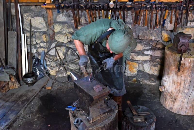 Blacksmith at work editorial image. Image of blacksmith - 73707810