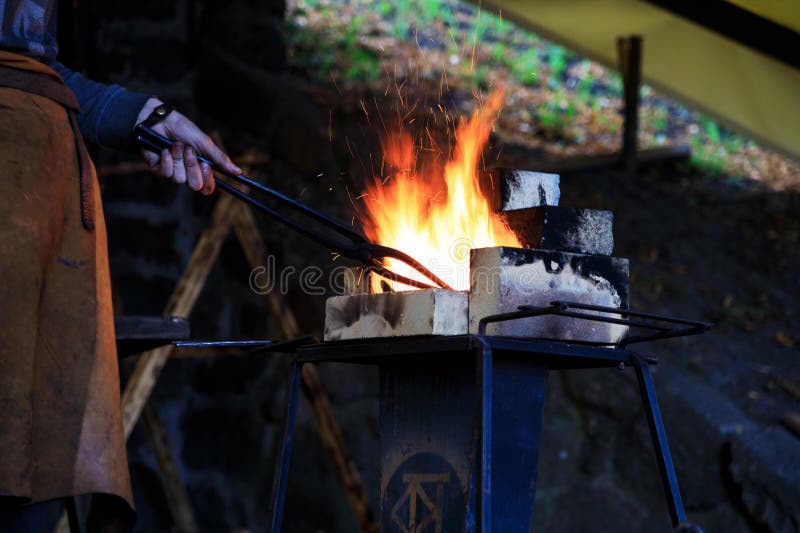 Blacksmith at Work. Process of Manufacture. Smithcraft. Stock Photo ...
