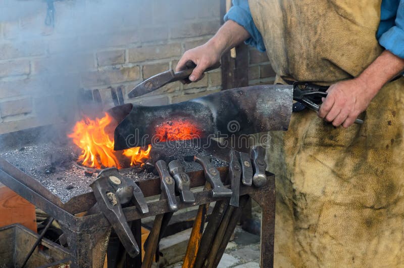Blacksmith stock image. Image of forgeman, black, molten - 64405047