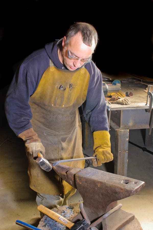 Blacksmith at work stock photo. Image of tradesman, protection - 42312926