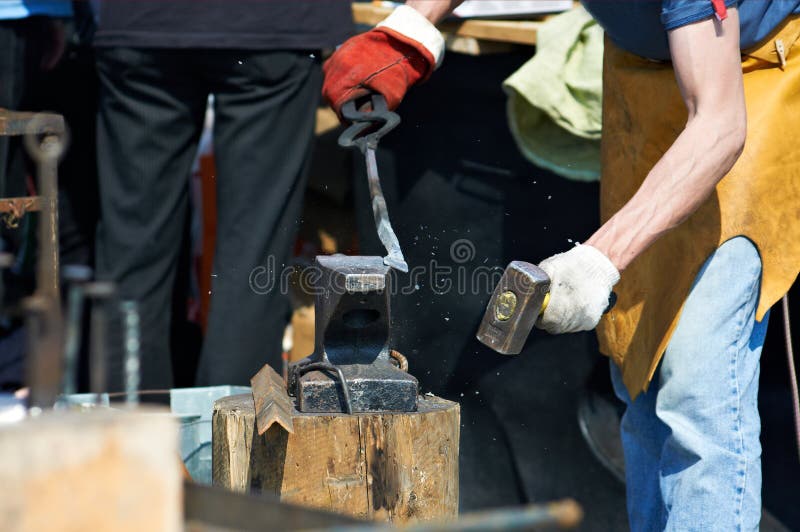 Blacksmith at work. stock image. Image of ancient, iron - 31087761