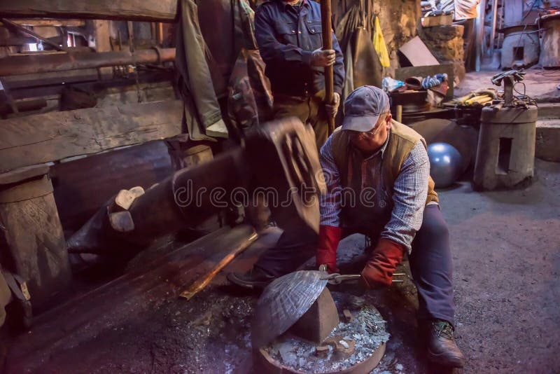 Blacksmith Workers Using Mechanical Hammer at Workshop Stock Image ...