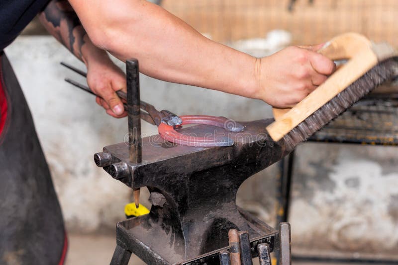 Blacksmith Working on the Anvil, Making a Horseshoe. Stock Image ...