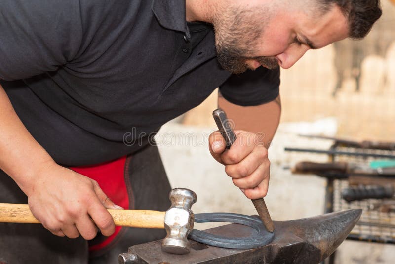 Blacksmith Working on the Anvil, Making a Horseshoe. Stock Image ...