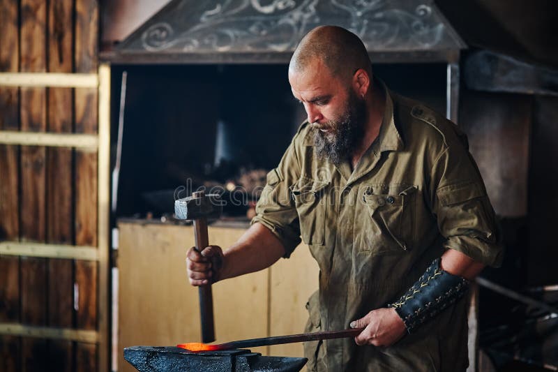 Blacksmith Working in the Forge. Manufacture of Parts and Weapons from ...