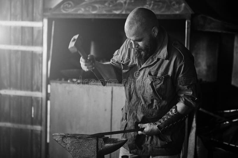 Blacksmith Working in the Forge. Manufacture of Parts and Weapons from ...