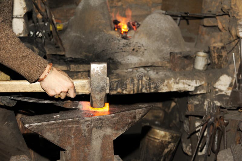 Blacksmith Working in the Forge Processes the Metal . Stock Photo ...
