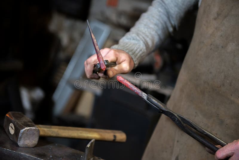 Blacksmith Working on an Anvil Stock Image - Image of hammer, equipment ...
