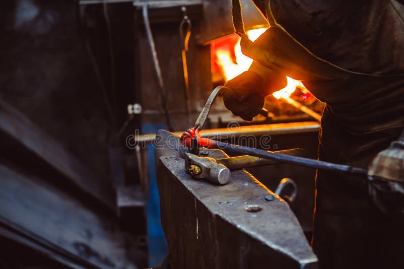 Blacksmith Working on an Anvil Stock Photo - Image of molten ...