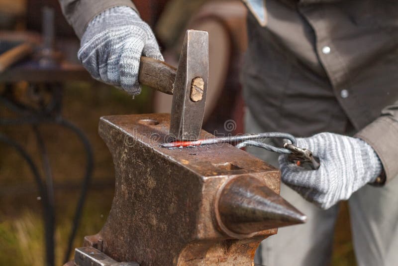 Blacksmith Working on Metal on Anvil at Forge High Speed Detail Shot ...
