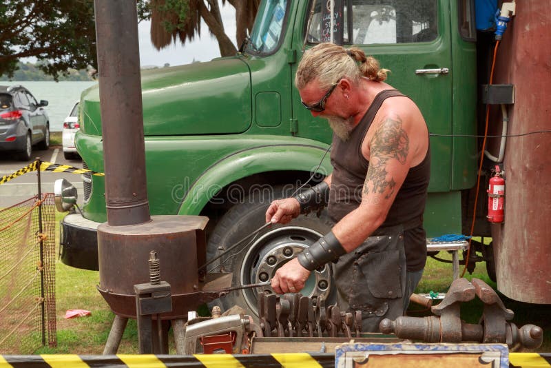 A Blacksmith Working with a Small Forge at a Travelling Fair Editorial ...