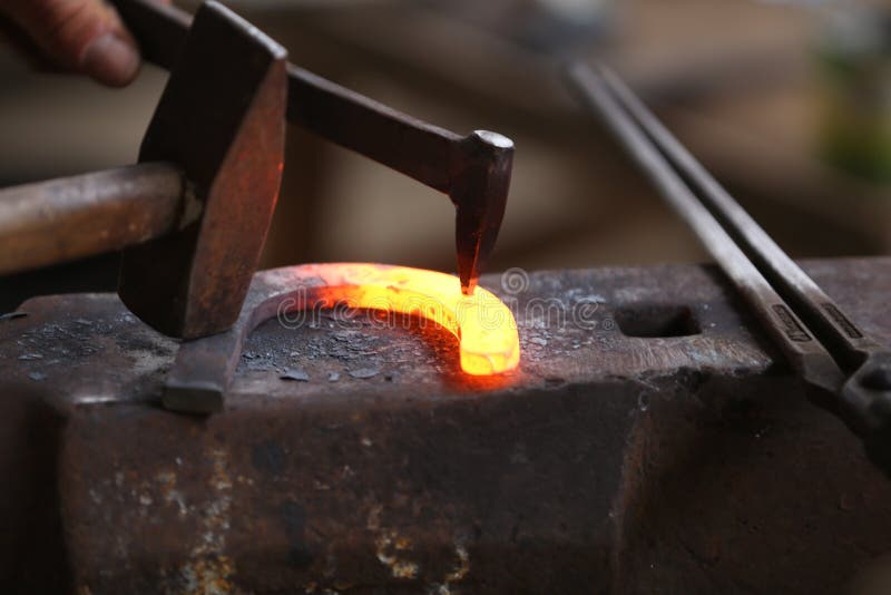 Blacksmith Working at Smithy Workshop Stock Image - Image of glowing ...