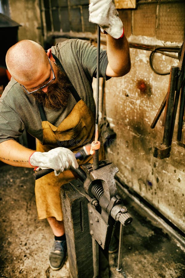 Blacksmith Working in Workshop Stock Photo - Image of blacksmith ...