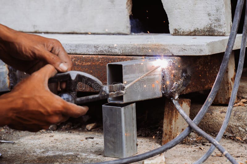 A Blacksmith is Crafting an Axe in a Workshop with Hot Metal in this ...