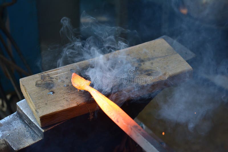 Blacksmith in His Home Workshop Making Tools Stock Photo - Image of ...