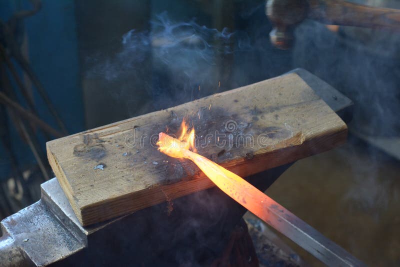 Blacksmith in His Home Workshop Making Tools Stock Photo - Image of ...