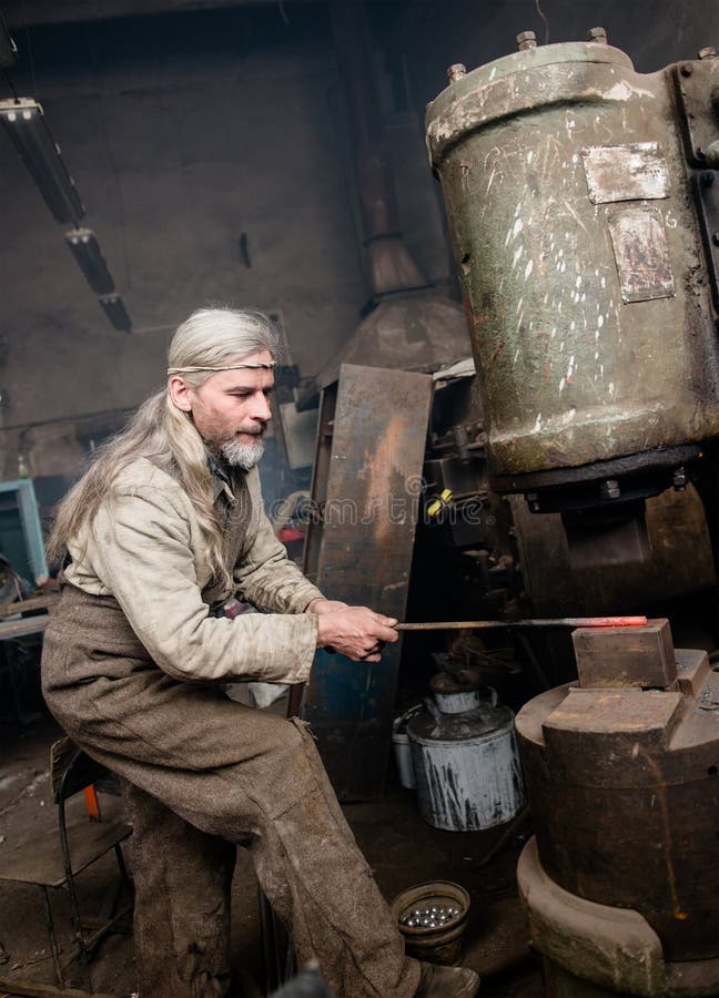Blacksmith Works with a Power Hammer Stock Image - Image of business ...