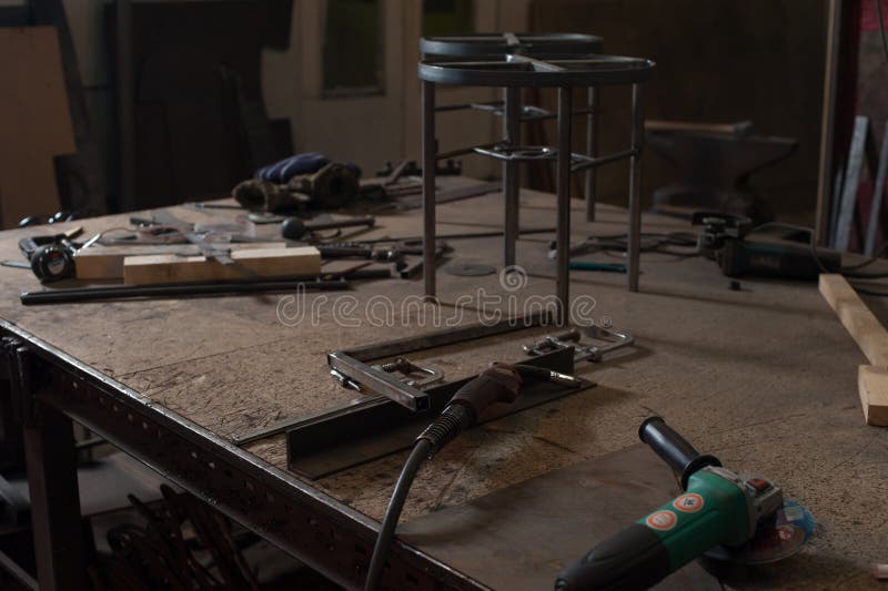 Blacksmith Table with Manifactured Metal Chairs Stock Photo - Image of ...