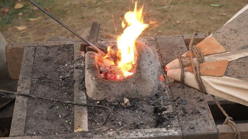 Blacksmiths Working Old Fashioned Bellows at the Forge. the Blacksmith ...