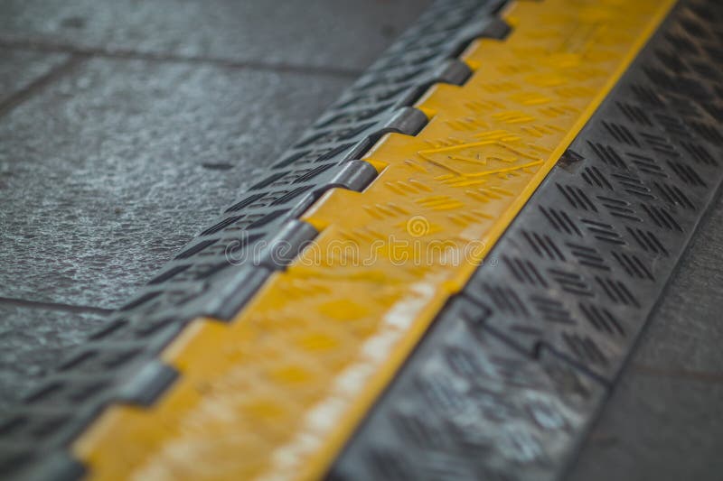 Blacl and Yellow Plastic Cable Protector Cover Stock Photo - Image of ...