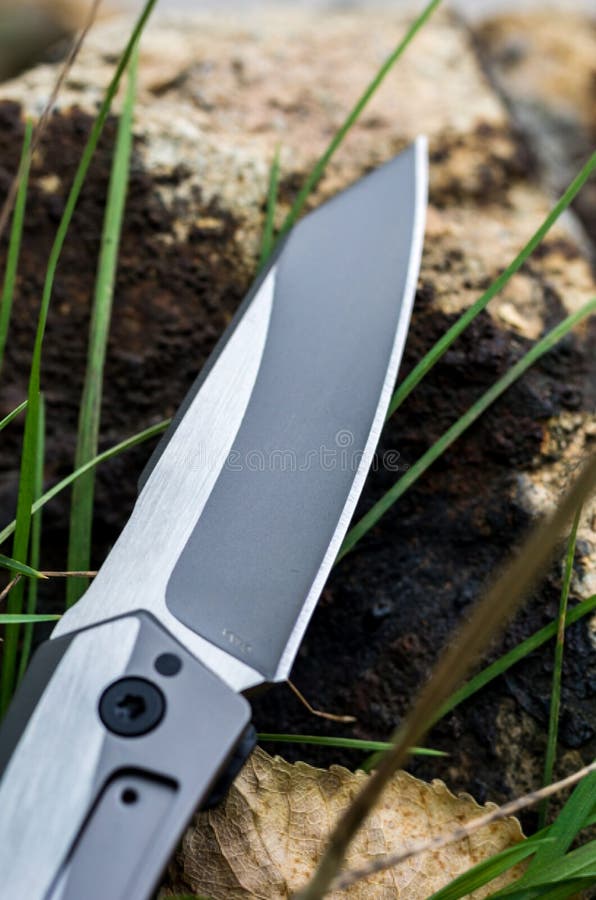 Blade of Sharp Knife. Blade on the Background of Stones Stock Photo ...